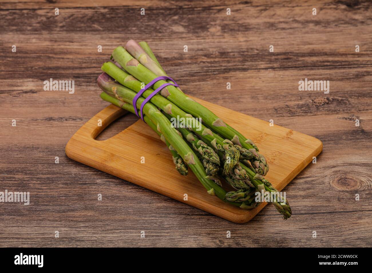 Vegan cuisine - Raw asparagus heap for cooking Stock Photo - Alamy
