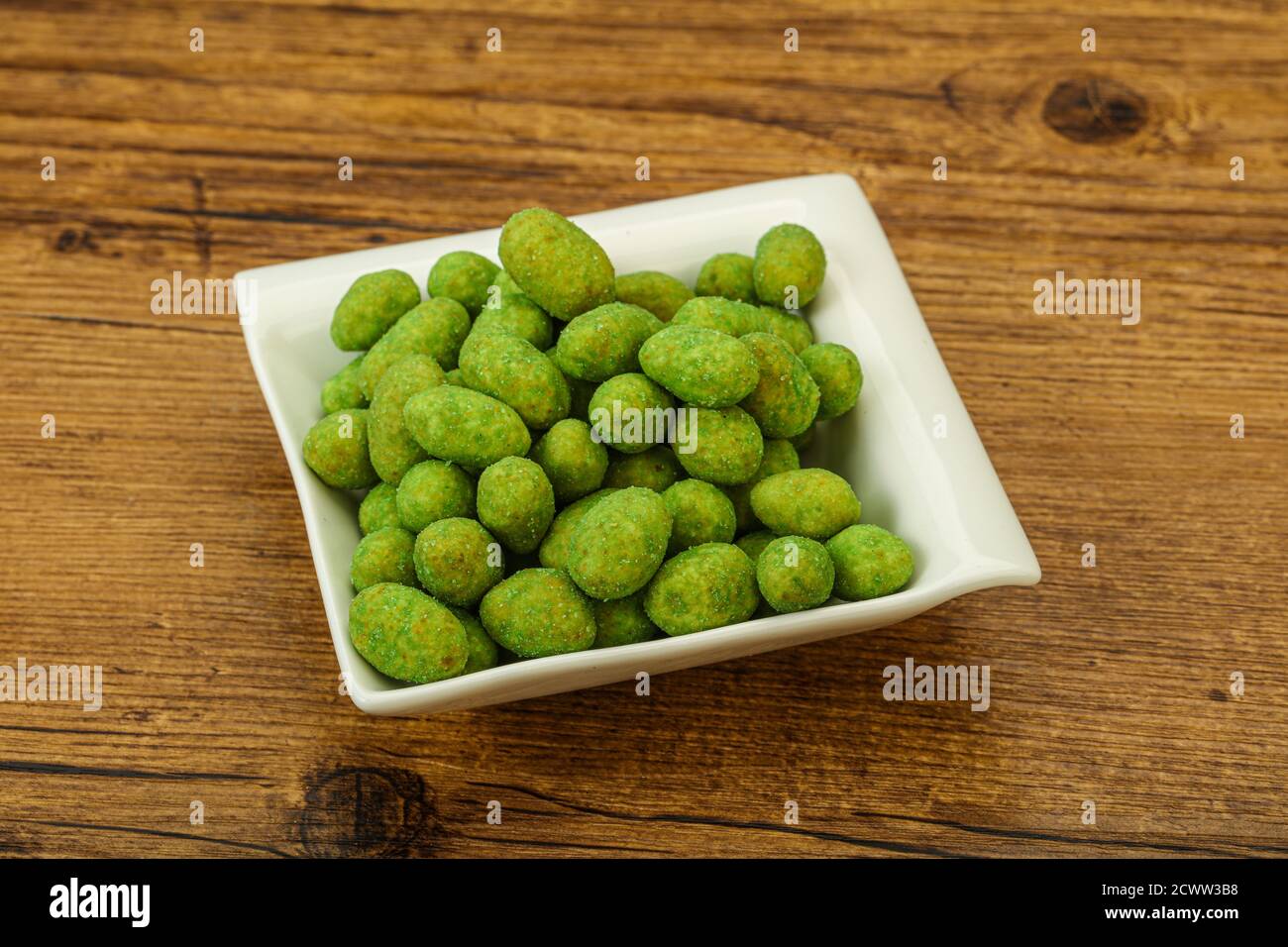 Spicy wasabi peanuts snack in the bowl Stock Photo - Alamy