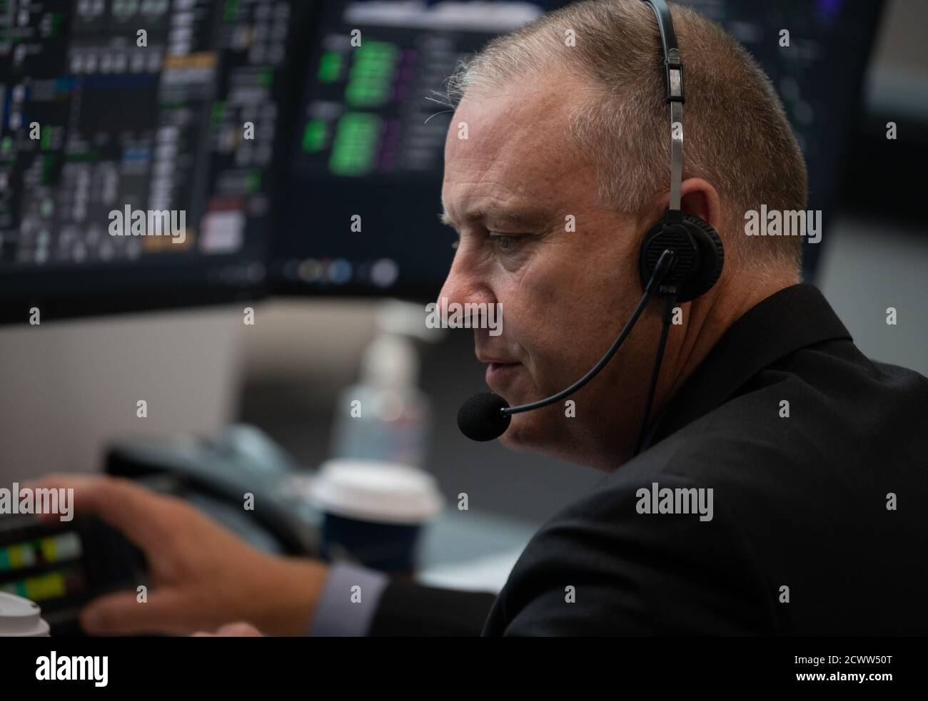 NASA's deputy director of Flight Operations, Norm Knight, monitors the ...