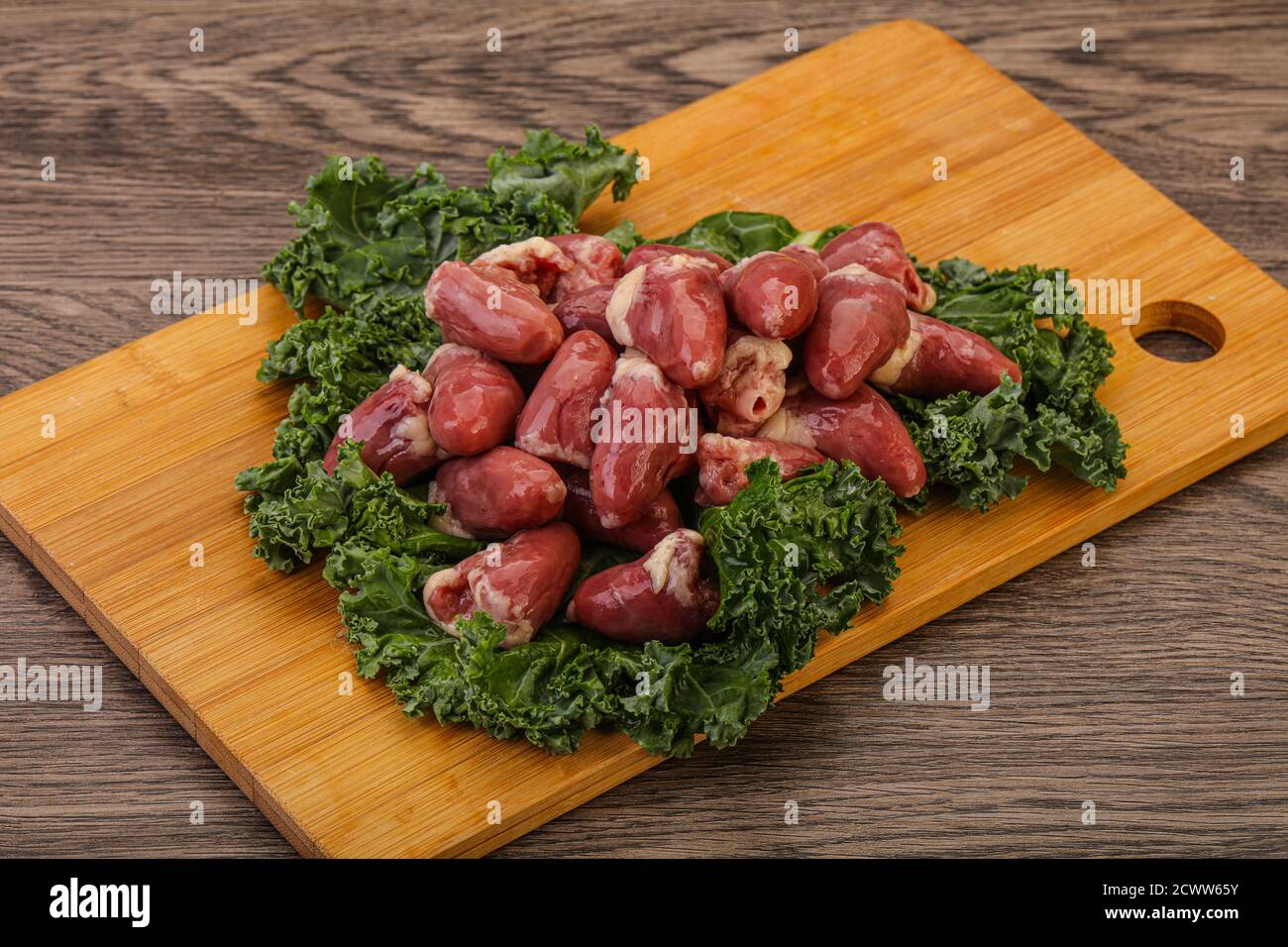 Raw chicken hearts heap for cooking Stock Photo - Alamy