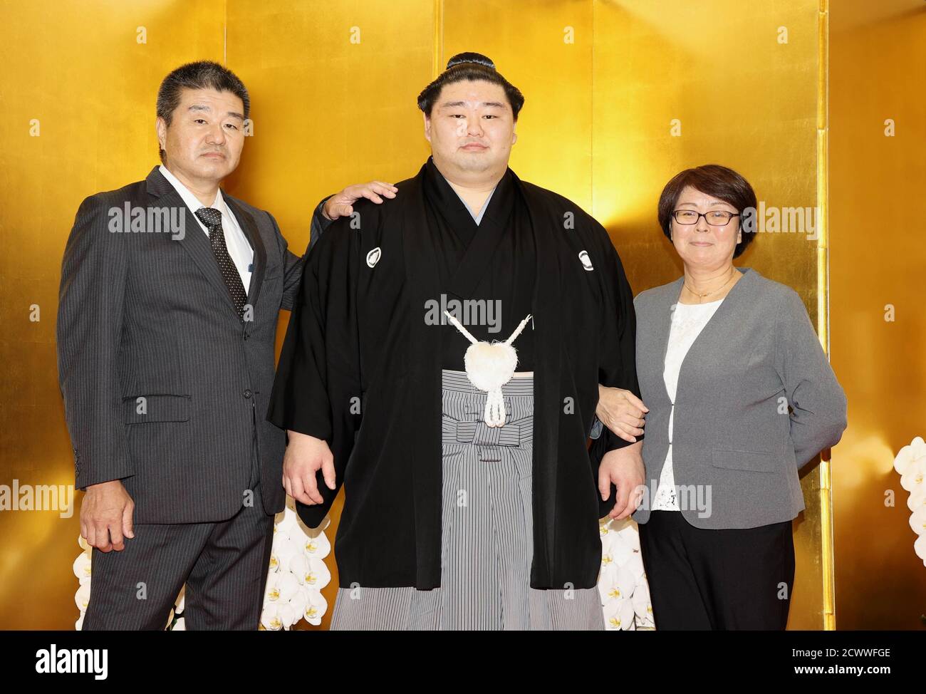 Sumo wrestler Shodai poses for a photo together with his parents in his ...