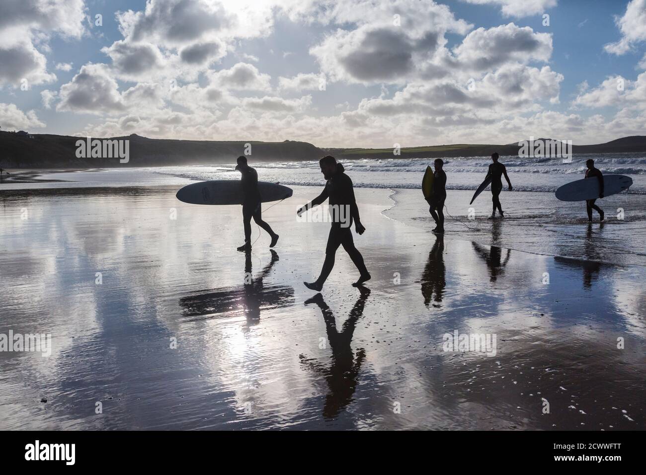 Surfers on the welsh coast Stock Photo - Alamy