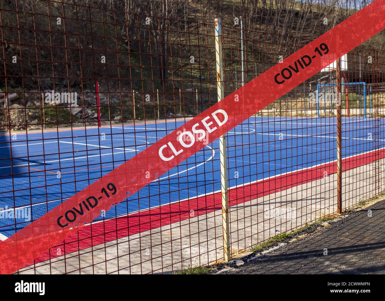 CLOSED COVID-19 red tape in a basketball court Stock Photo - Alamy