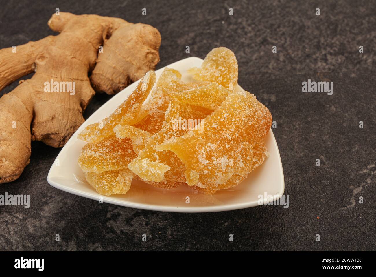 Dry sweet ginger snack in the bowl Stock Photo - Alamy