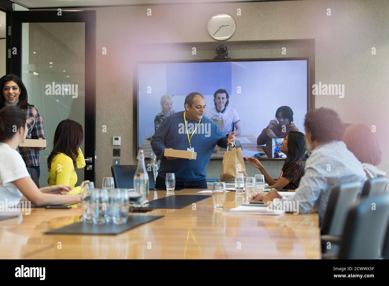 Business people arriving with lunch in conference room meeting Stock ...