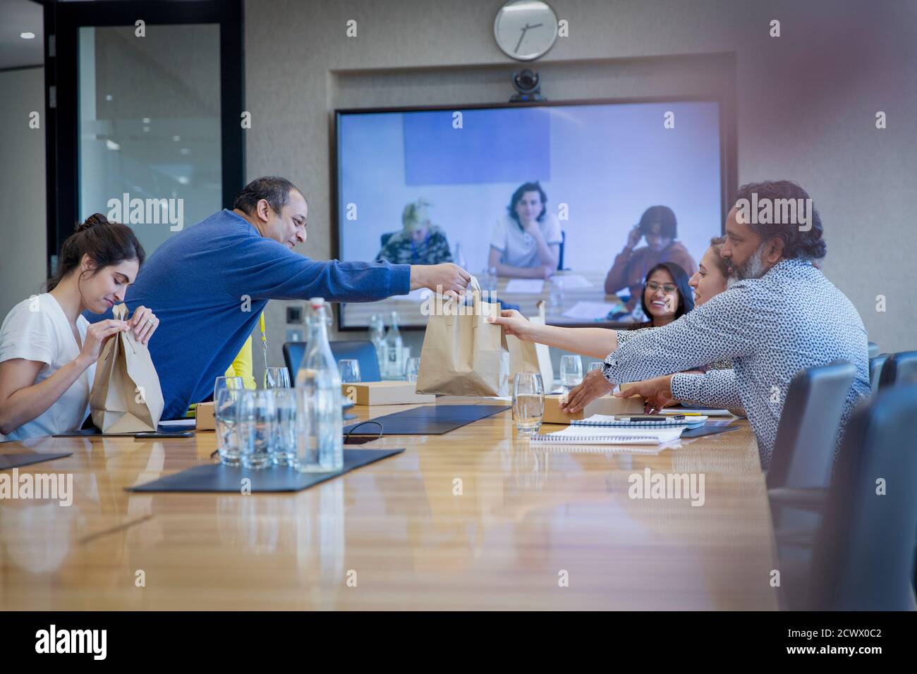 Business people with lunch in conference room meeting Stock Photo - Alamy