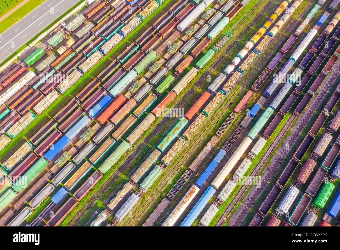 Cargo railway carriage. Colorful freight trains on the railway sort ...