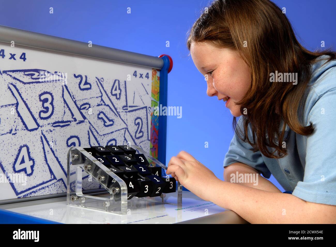 Children Engaging with Practical Learning Games Stock Photo - Alamy