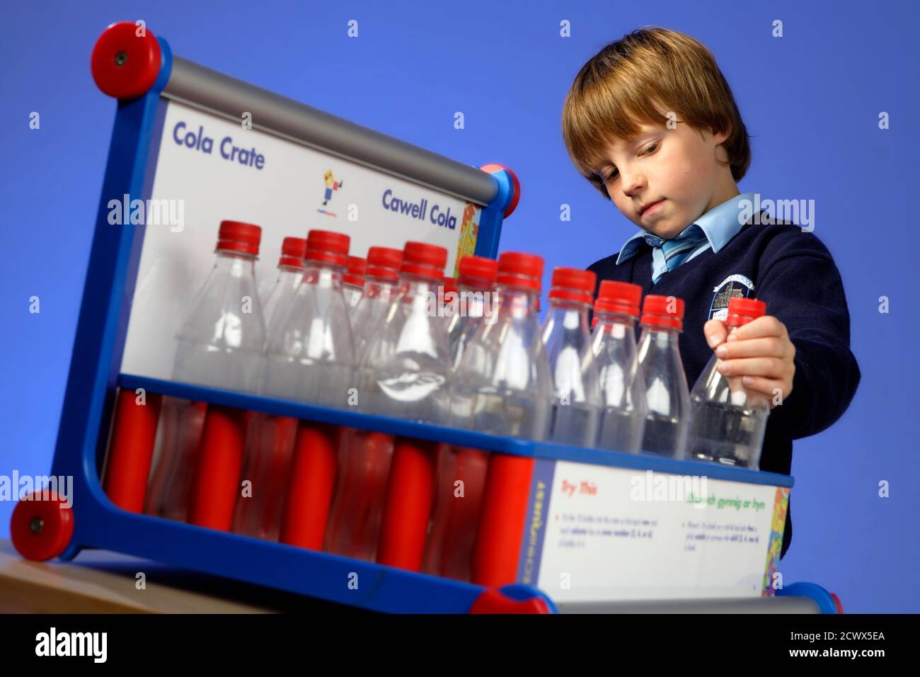 Children Engaging with Practical Learning Games Stock Photo - Alamy