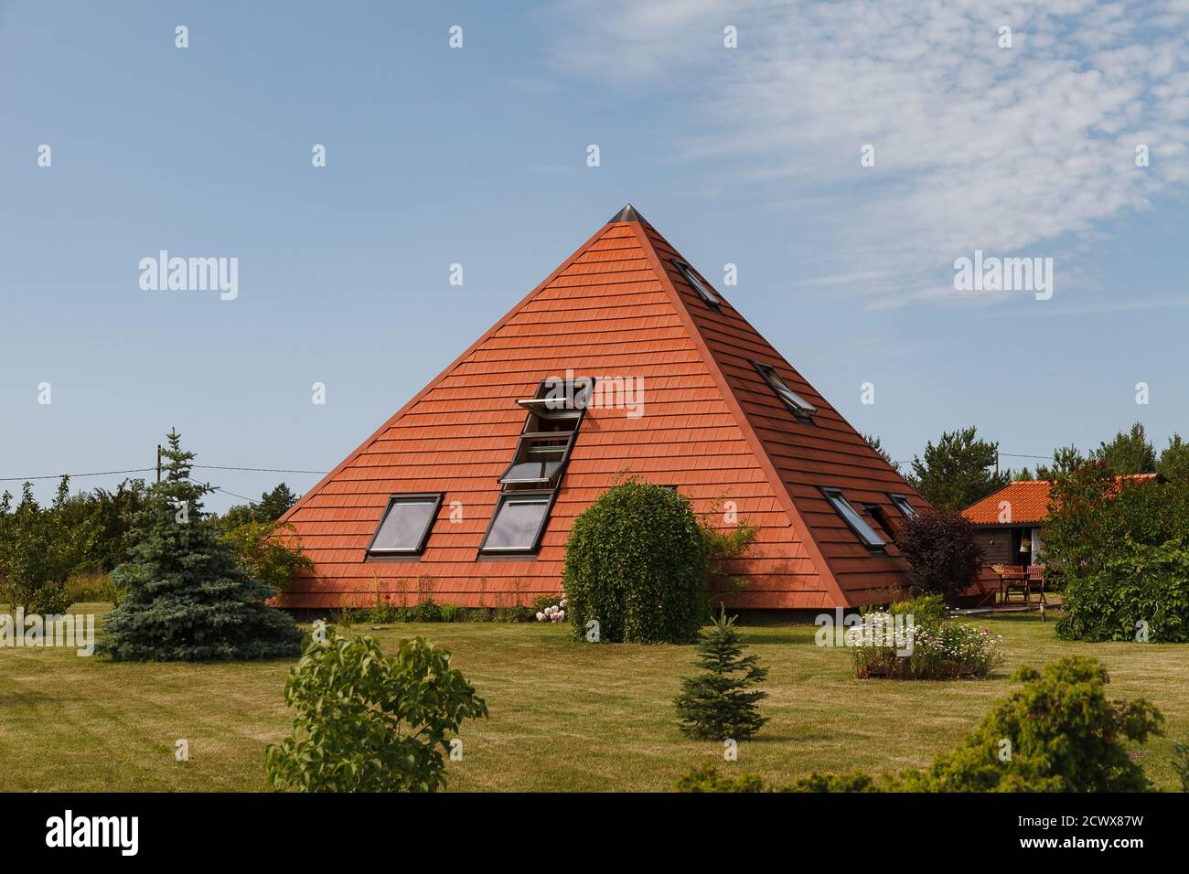 House build as pyramid. Tiled roof. Oriental approach used in Europe ...