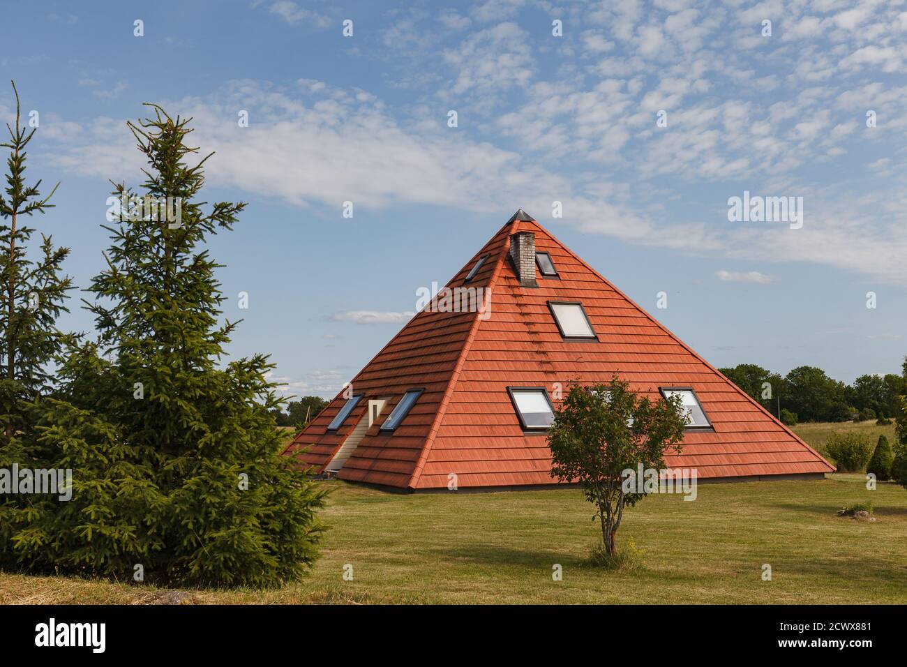 House build as pyramid. Tiled roof. Oriental approach used in Europe ...