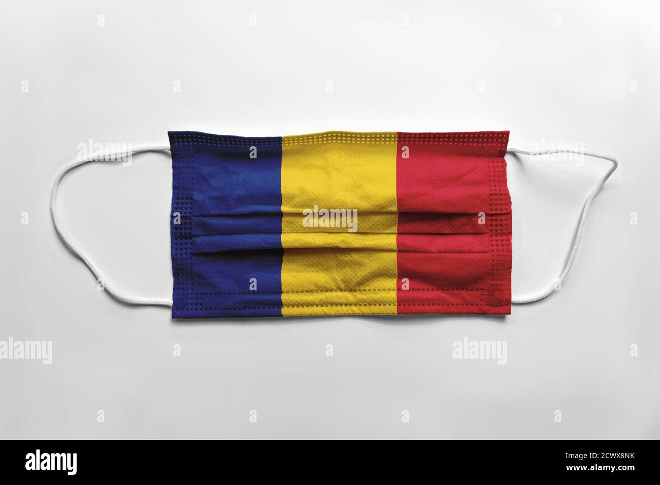 Face mask with Romania flag printed, on white background, isolated ...