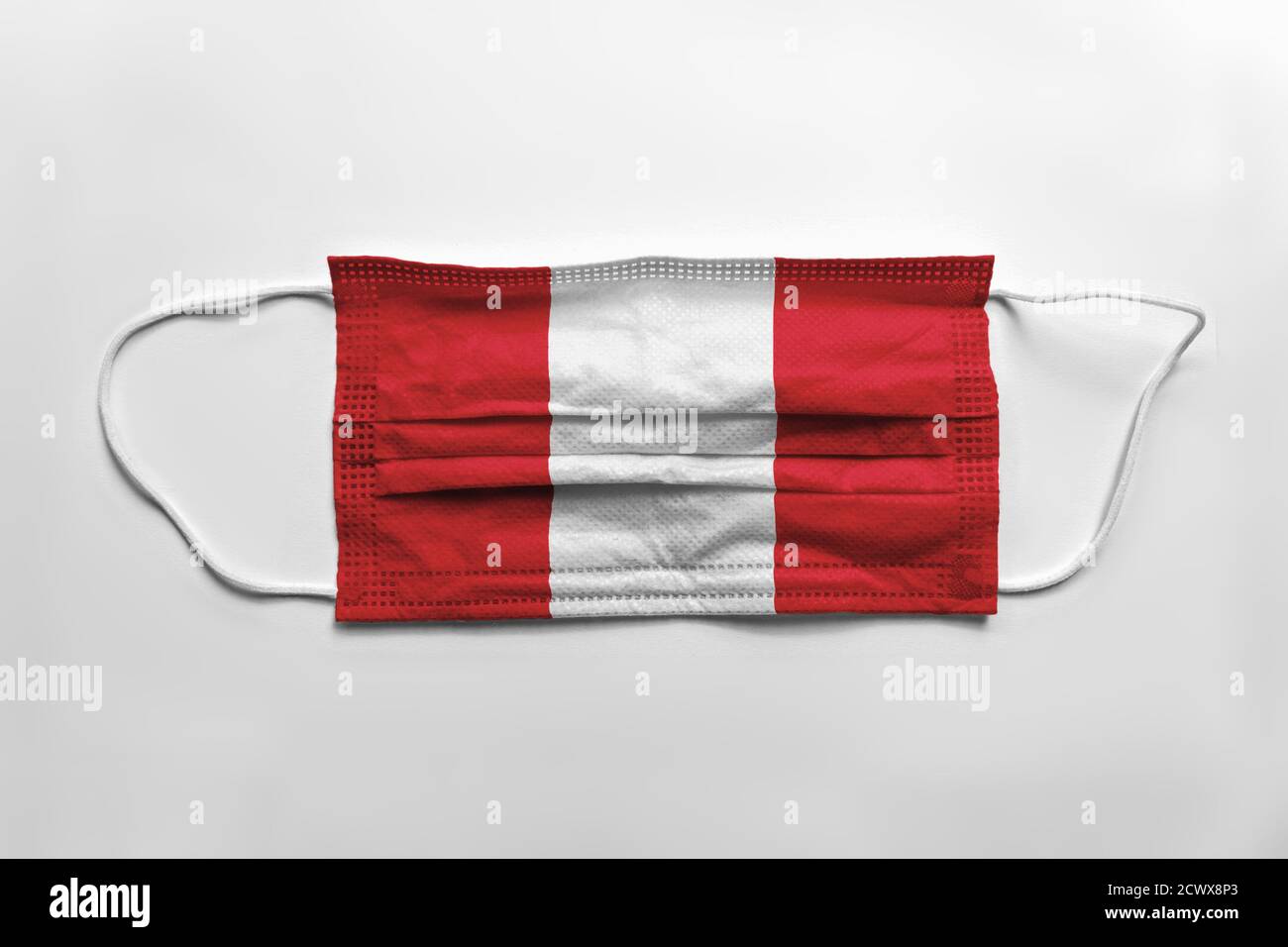 Face mask with Peru flag printed, on white background, isolated. Covid ...