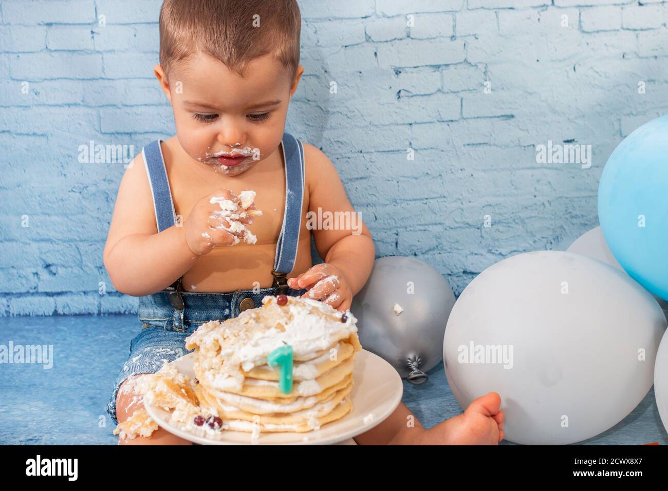 Party for one year baby boy with a set composed of balloons, ribbons ...