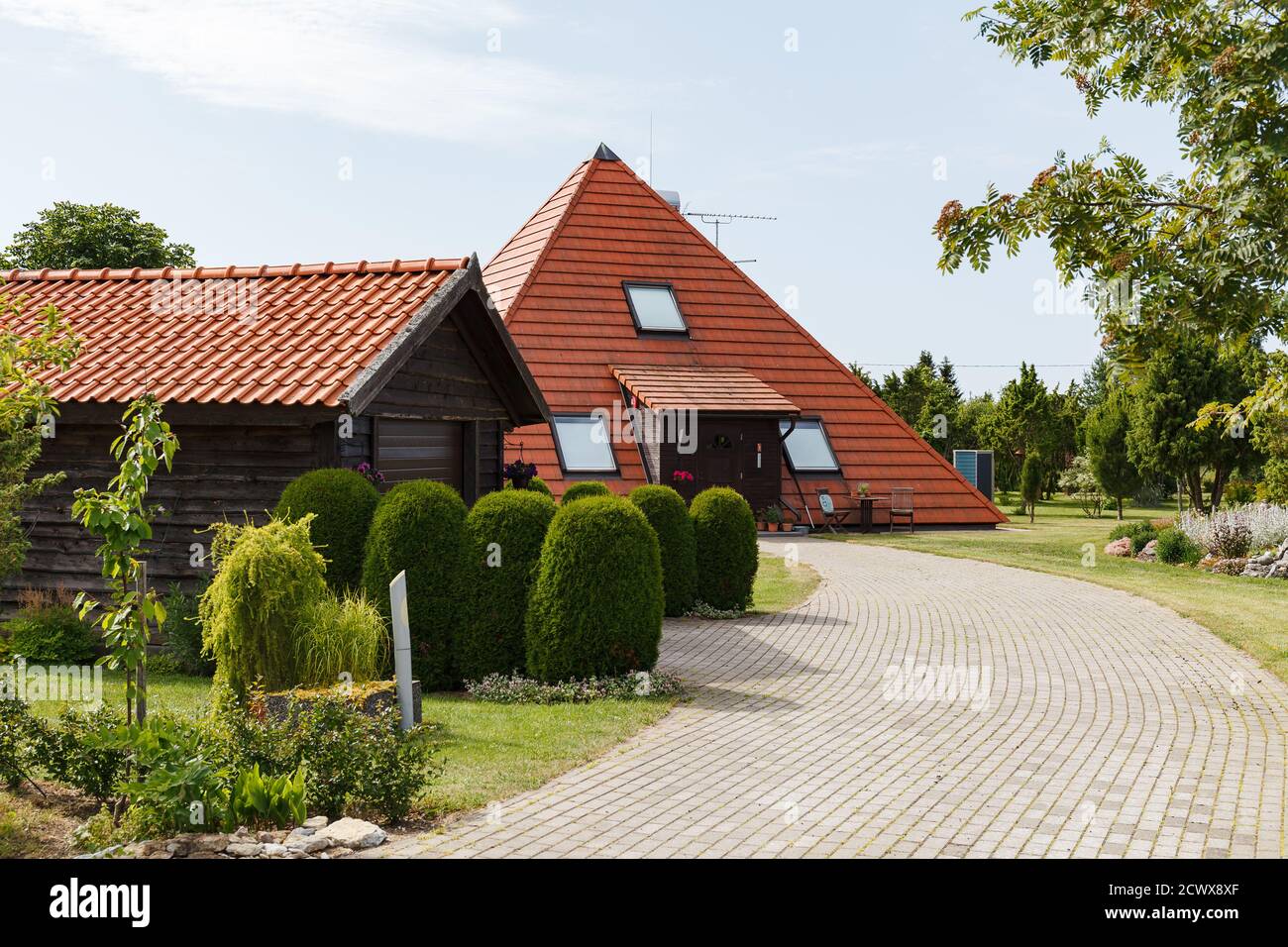 House build as pyramid. Tiled roof. Oriental approach used in Europe ...