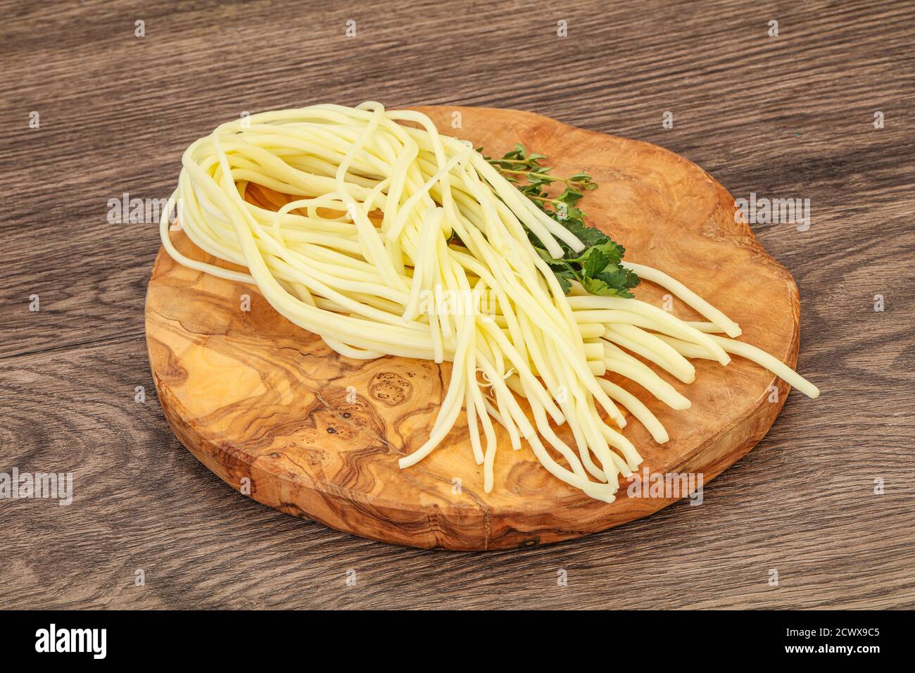 Chechil spaghetti cheese snack over board Stock Photo - Alamy
