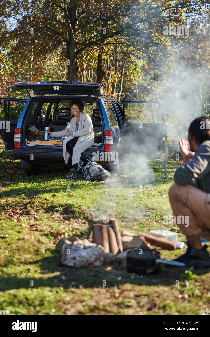 Woman starting campfire hi-res stock photography and images - Alamy