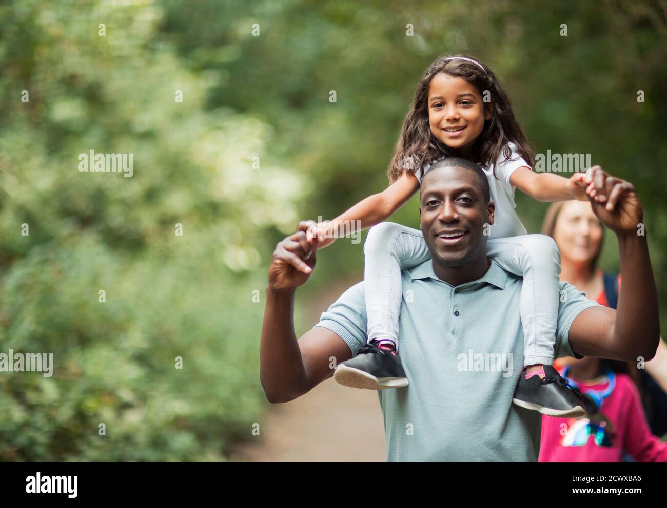 Father carrying daughter on shoulders hi-res stock photography and images - Alamy