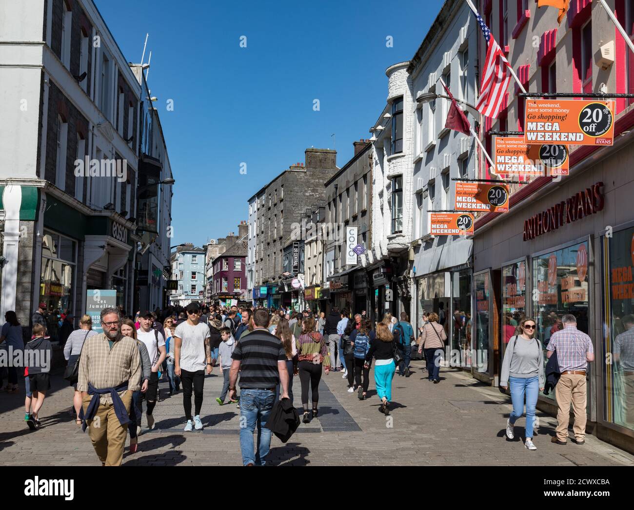 GALWAY CITY, IRELAND - 5th May, 2018: People walking on busy pedestrian ...
