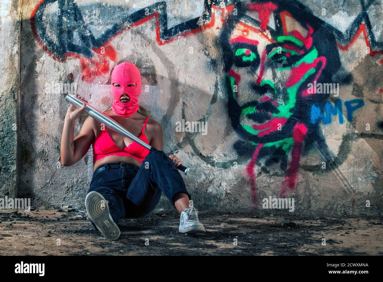Dangerous girl with bat and balaclava on a abandoned factory Stock ...