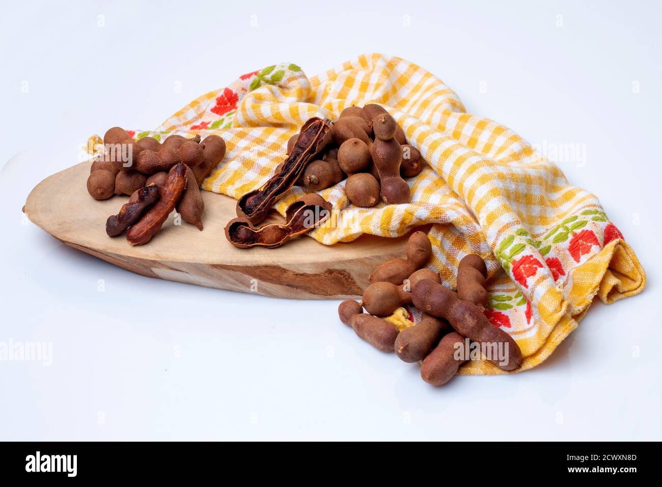 Tamarind fruit pods isolated on a white background Stock Photo - Alamy