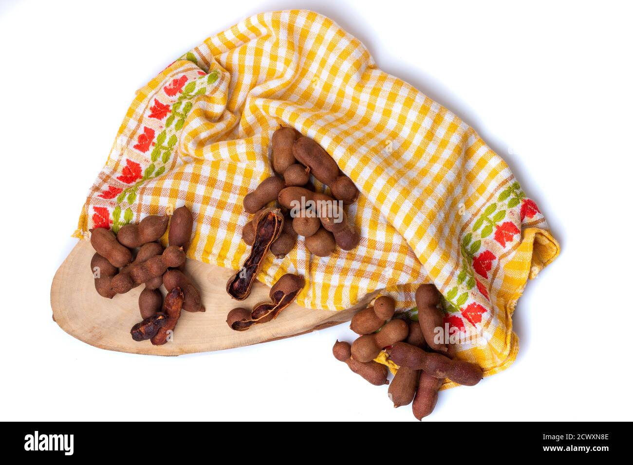 Tamarind fruit pods isolated on a white background Stock Photo - Alamy