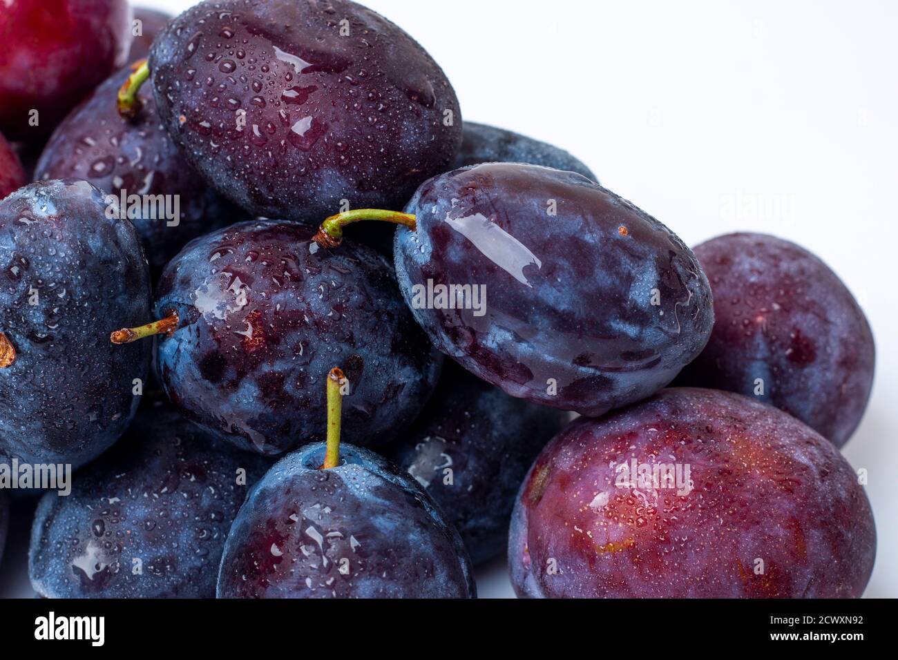 Fresh moyer purple plums isolated on a white background Stock Photo - Alamy