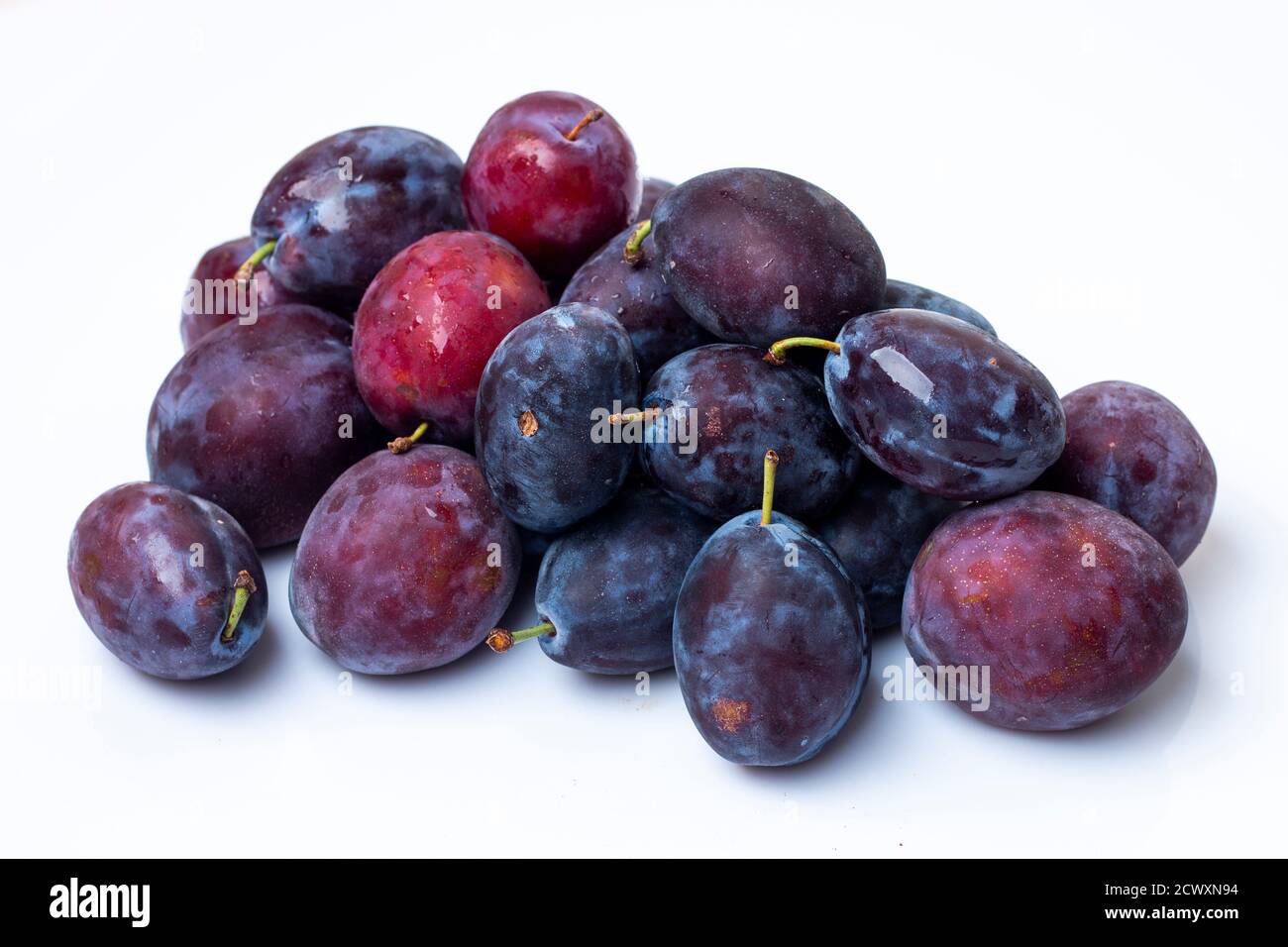 Fresh moyer purple plums isolated on a white background Stock Photo - Alamy