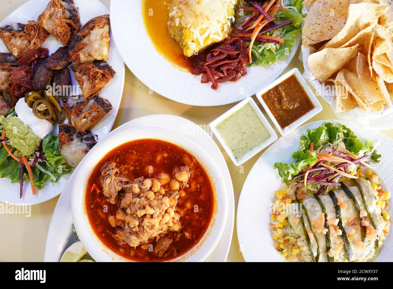 Top view shot of colorful different savory dishes on white plates Stock ...