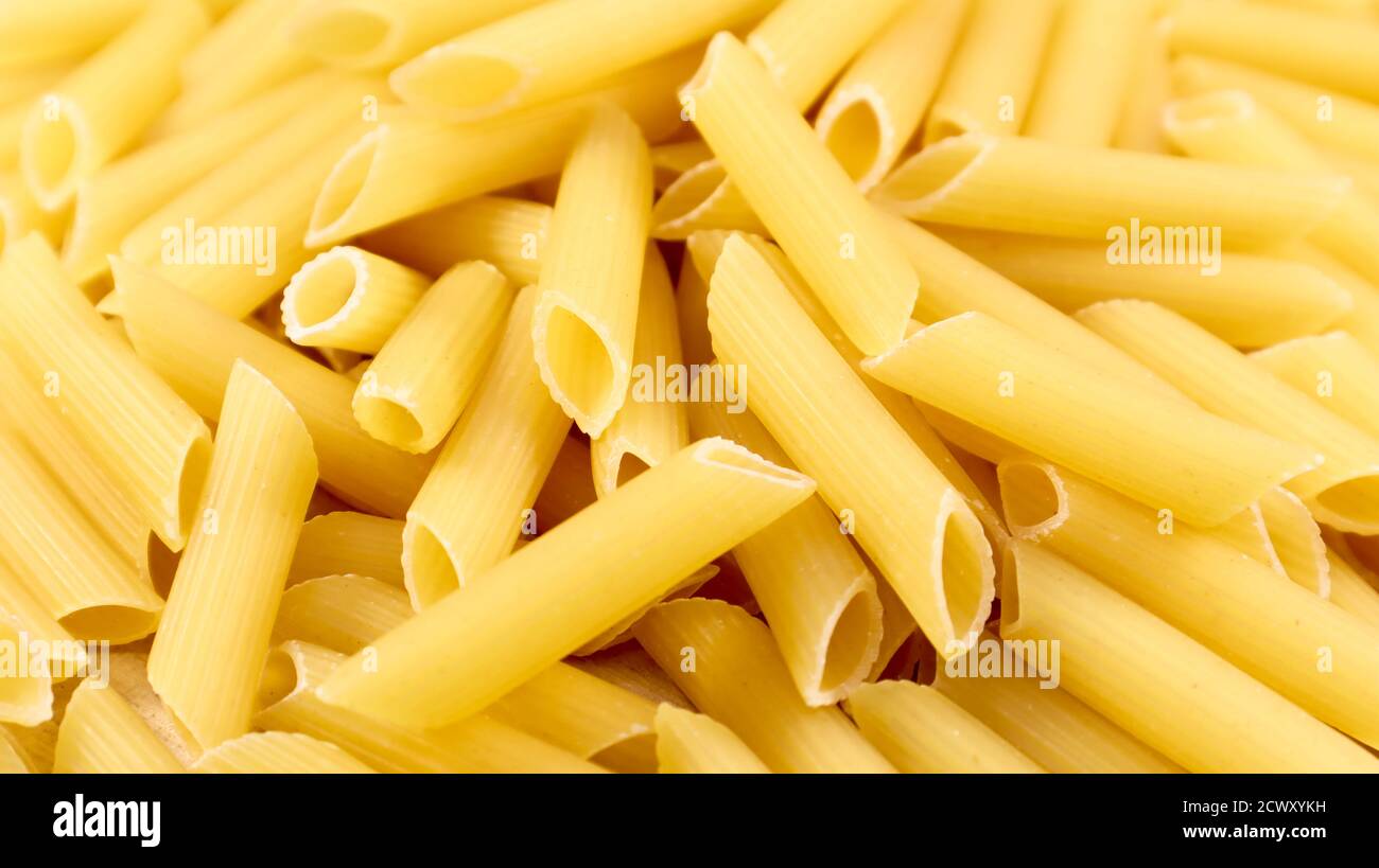 Penne Rigate Raw Pasta is a short pasta with oblique cuts and a ribbed ...