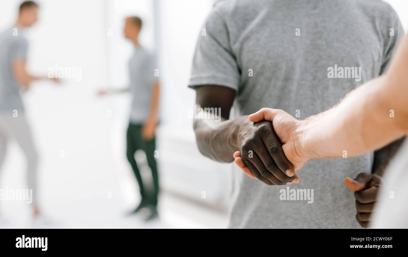close up. friendly handshake of young people Stock Photo - Alamy