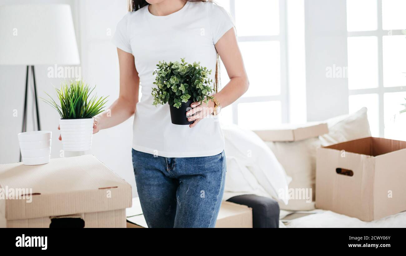 young woman placing her things in a new apartment Stock Photo - Alamy