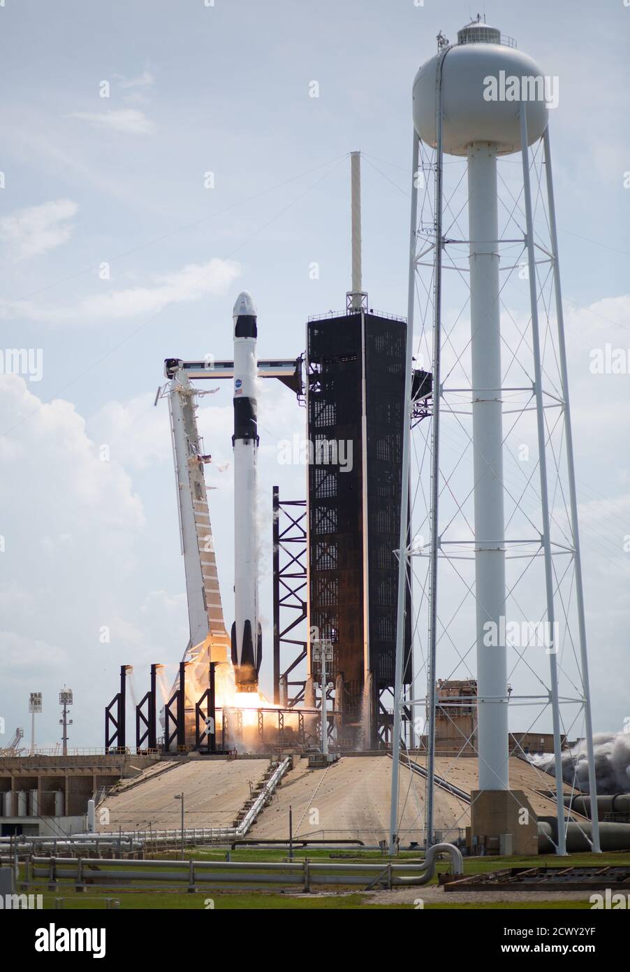 SpaceX Demo-2 Launch ]A SpaceX Falcon 9 rocket carrying the company's ...