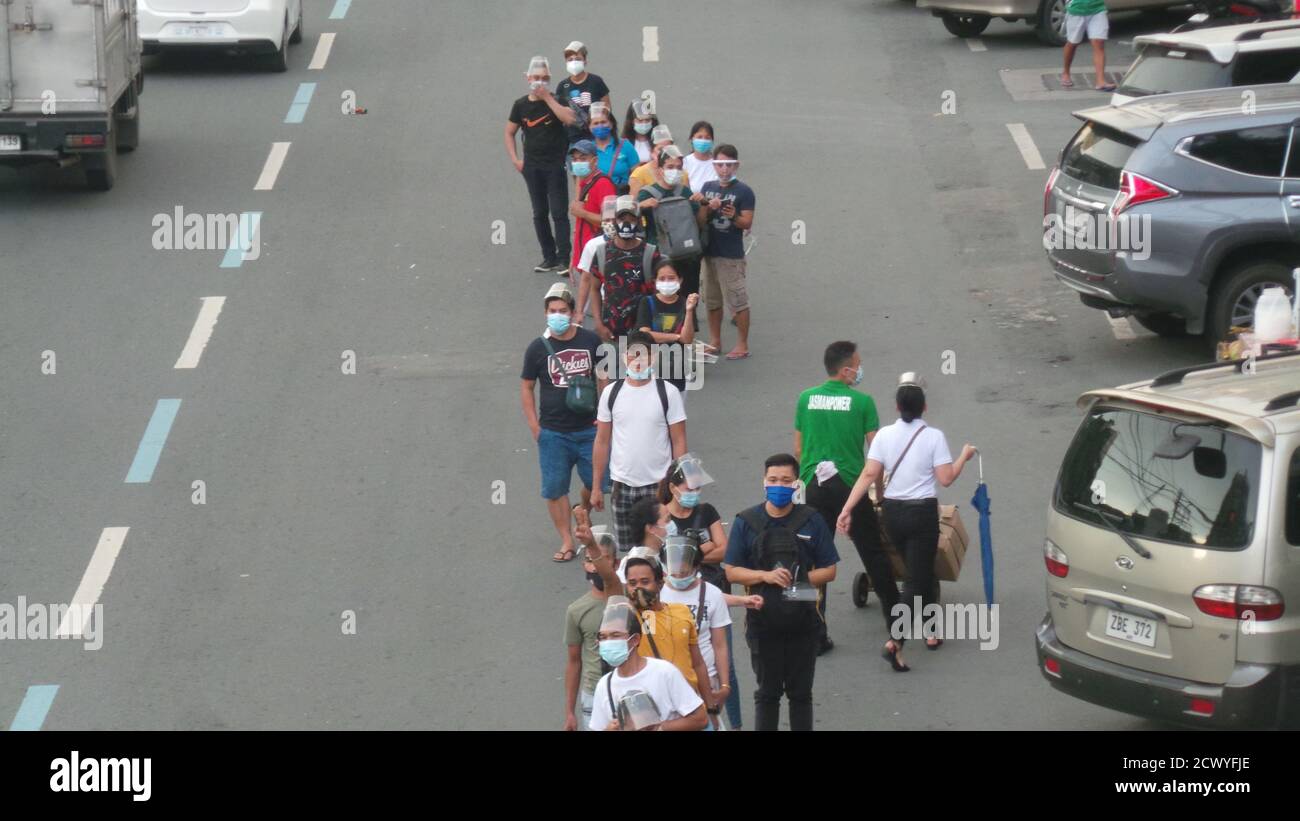 Manila, Philippines. 05th Jan, 2012. Long queue of commuters are seen ...