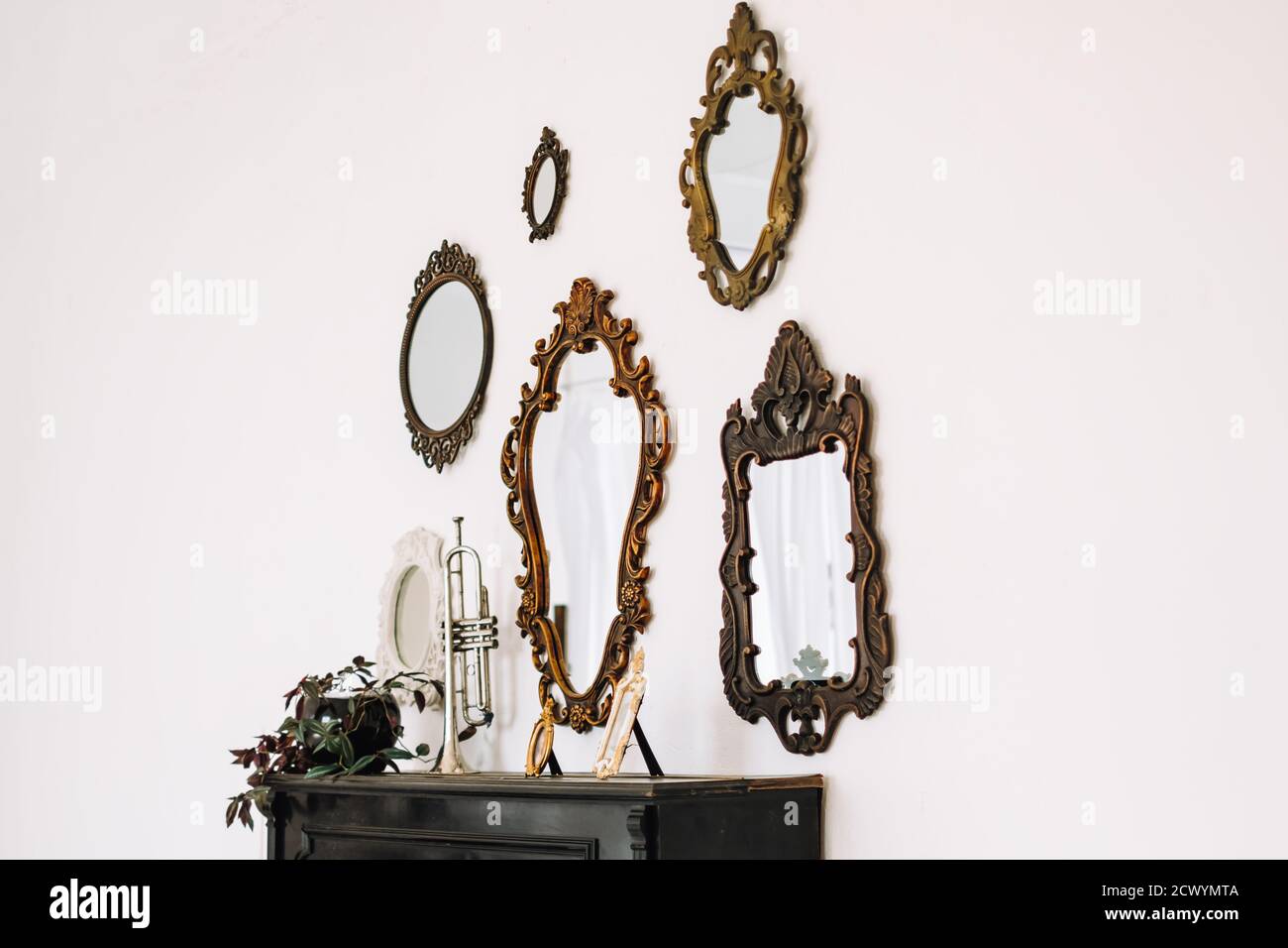 Antique old mirrors on a white wall indoor. Interior design Stock Photo ...