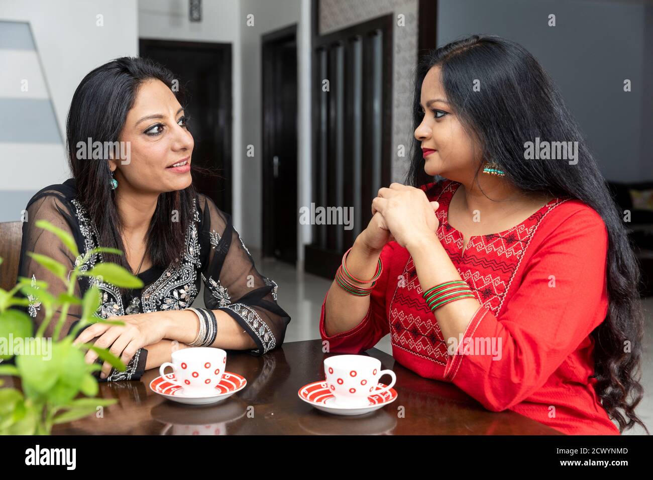Two girls having tea hi-res stock photography and images - Alamy
