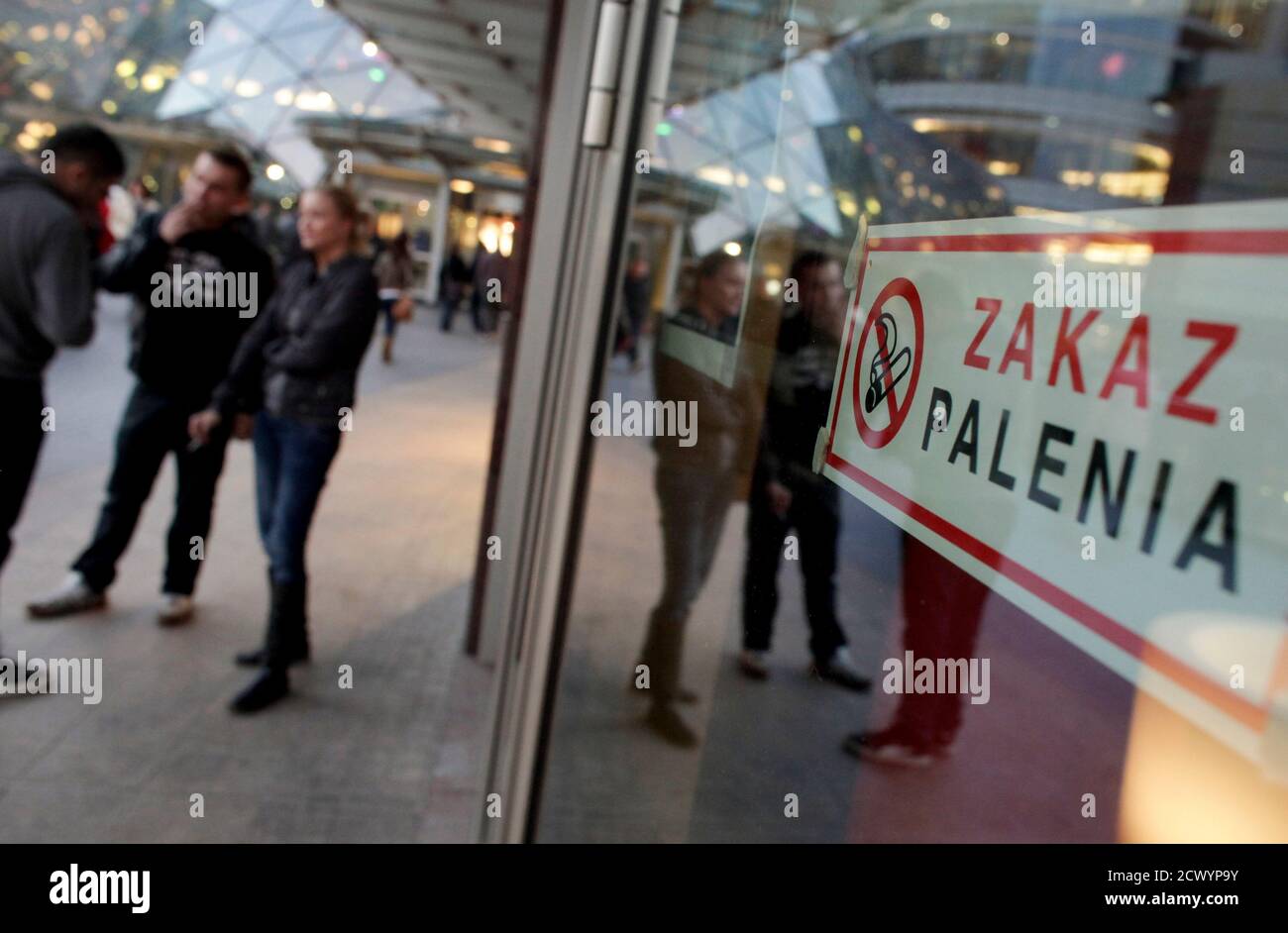 People smoking outside bar in hi-res stock photography and images - Alamy
