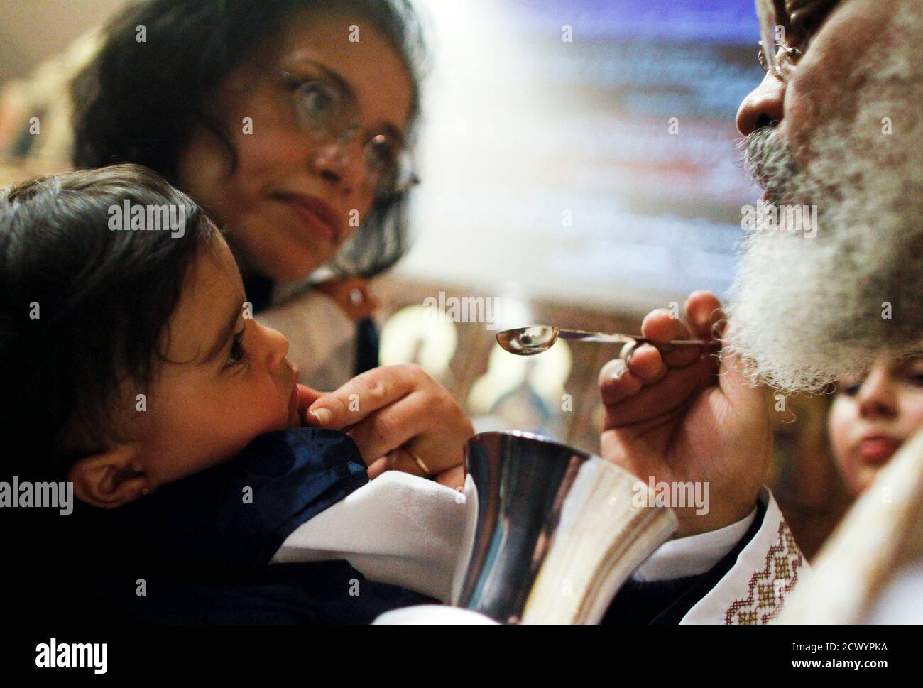 Child receives communion hi-res stock photography and images - Alamy