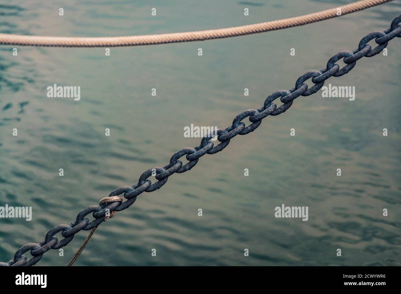 Chain over the water Stock Photo - Alamy