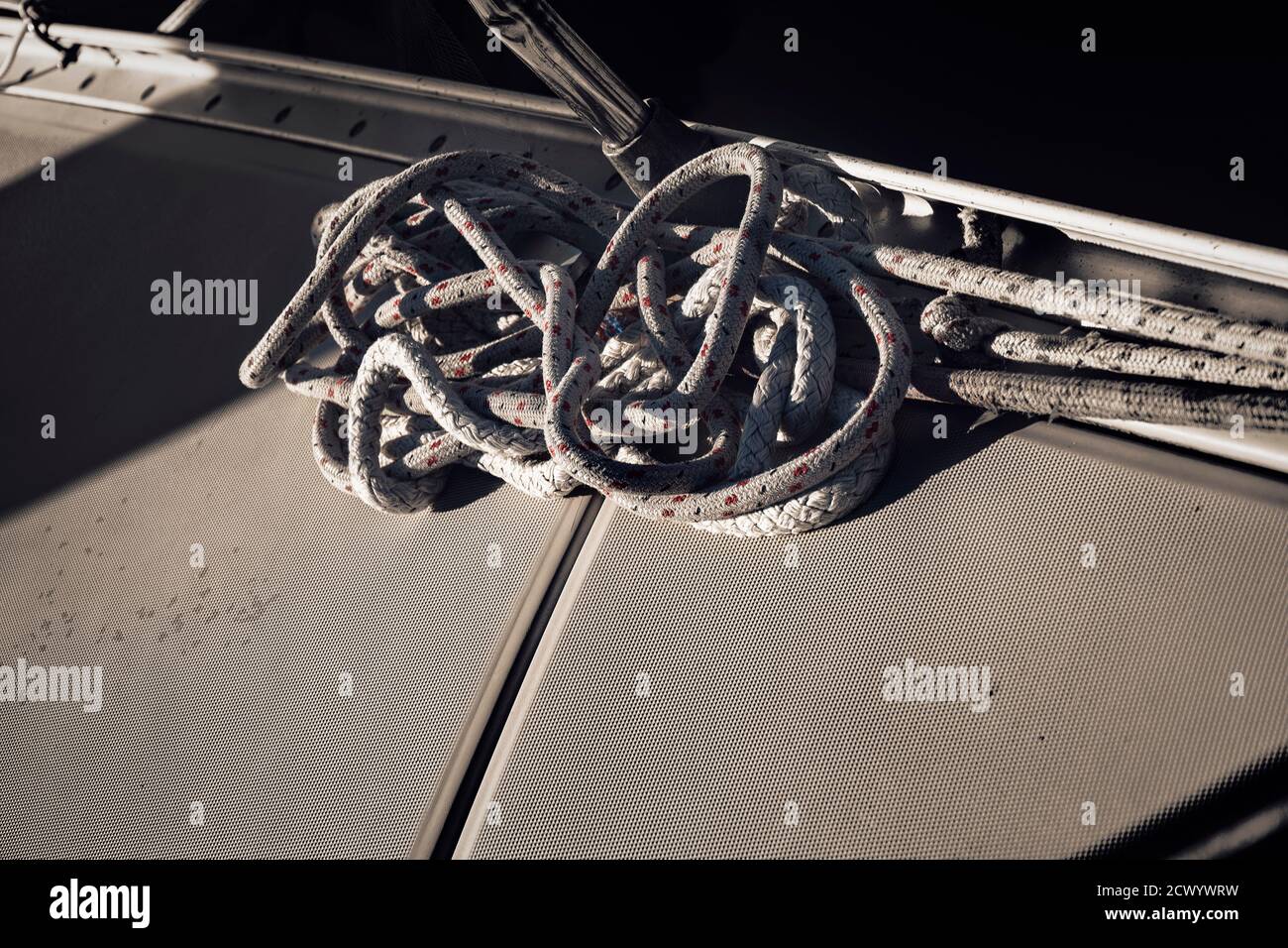 Close up of the boat cleat with a rope tied around it. Connection ...