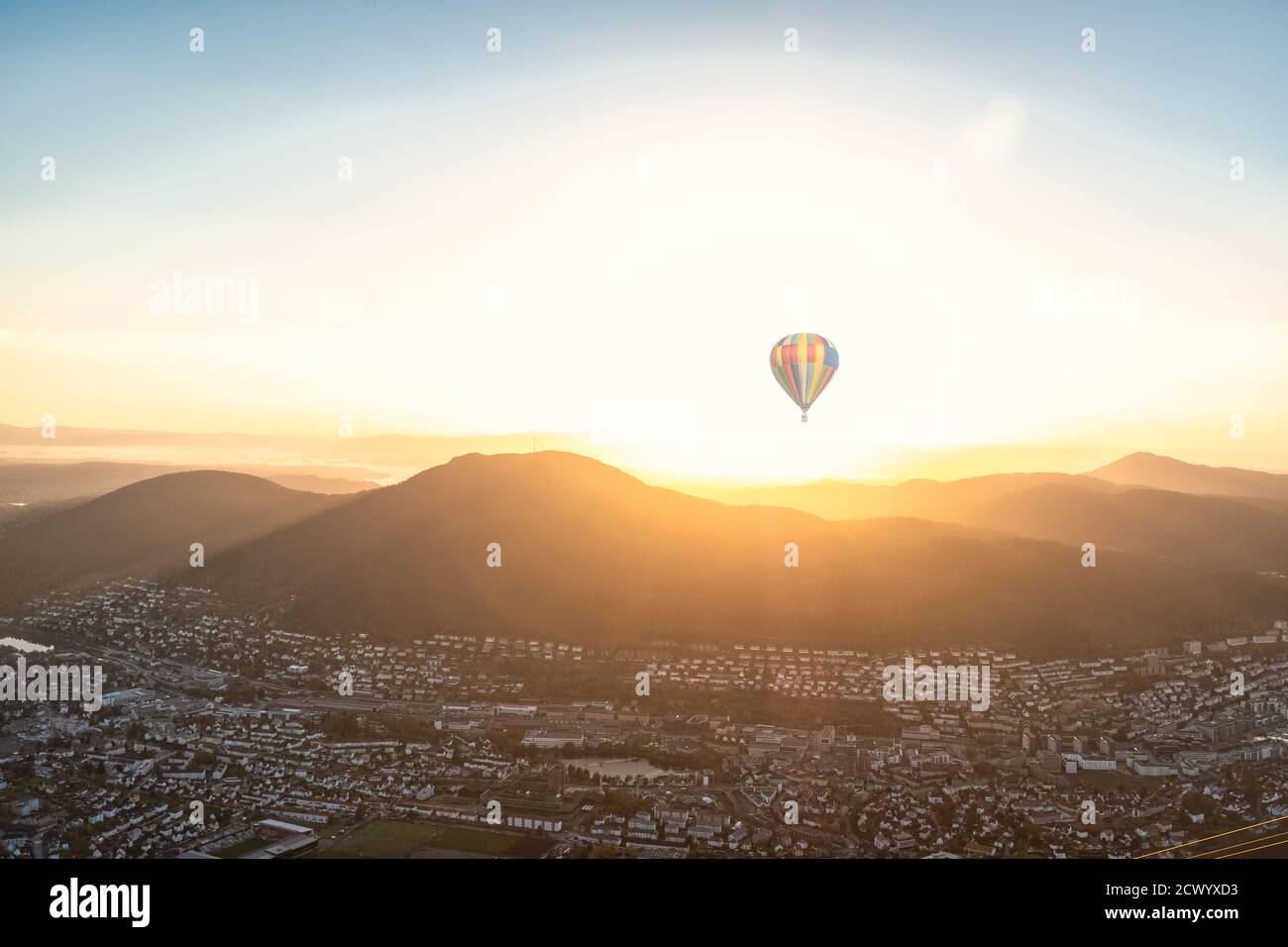 Cityscape of Bergen, Norway with mountains and hot air balloon in ...