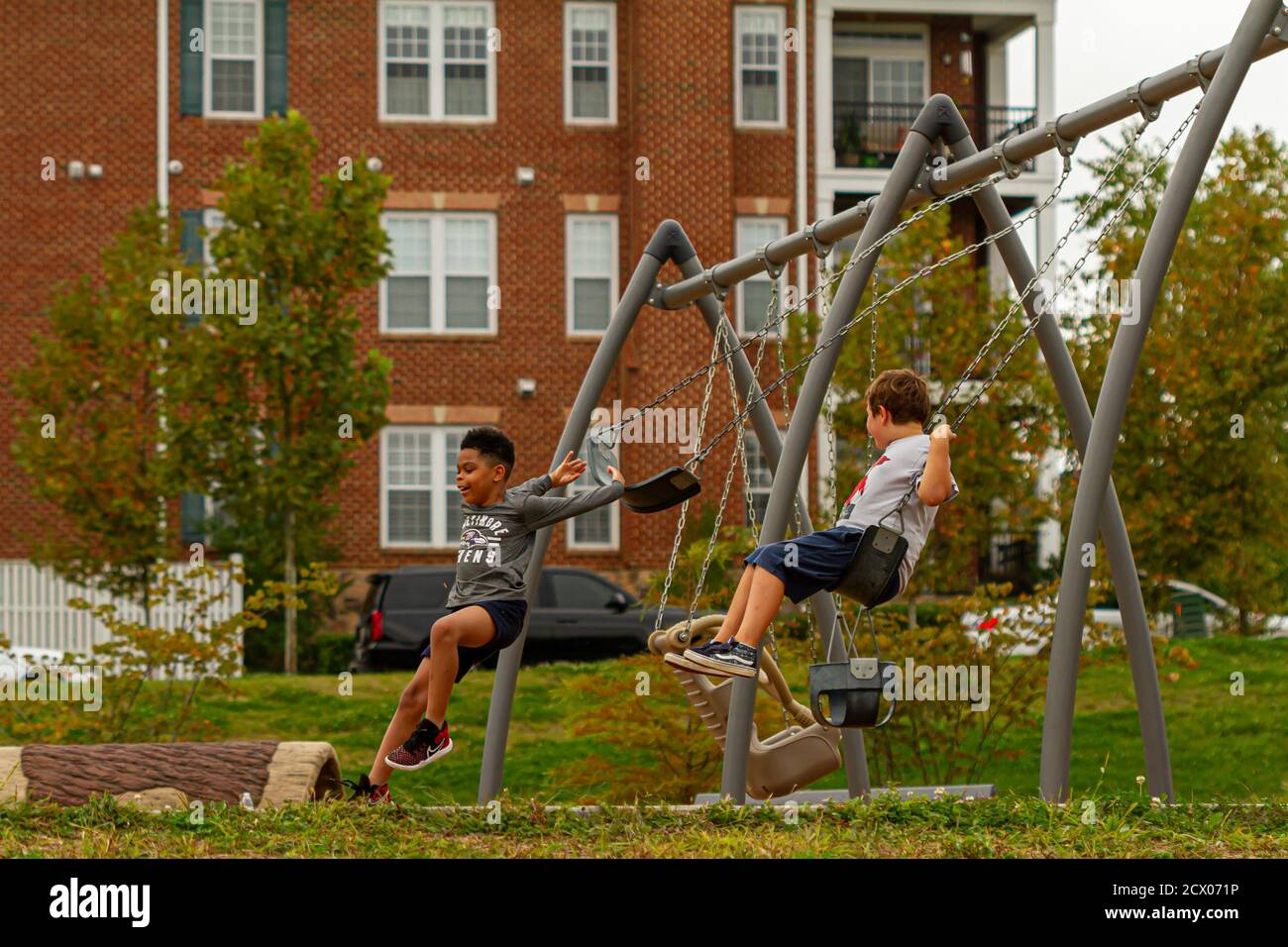 Happy Kids Playing In Playground