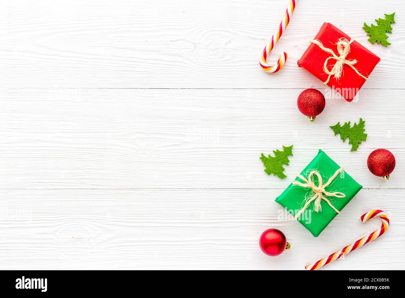 Christmas table layout with gifts and decorations Stock Photo - Alamy