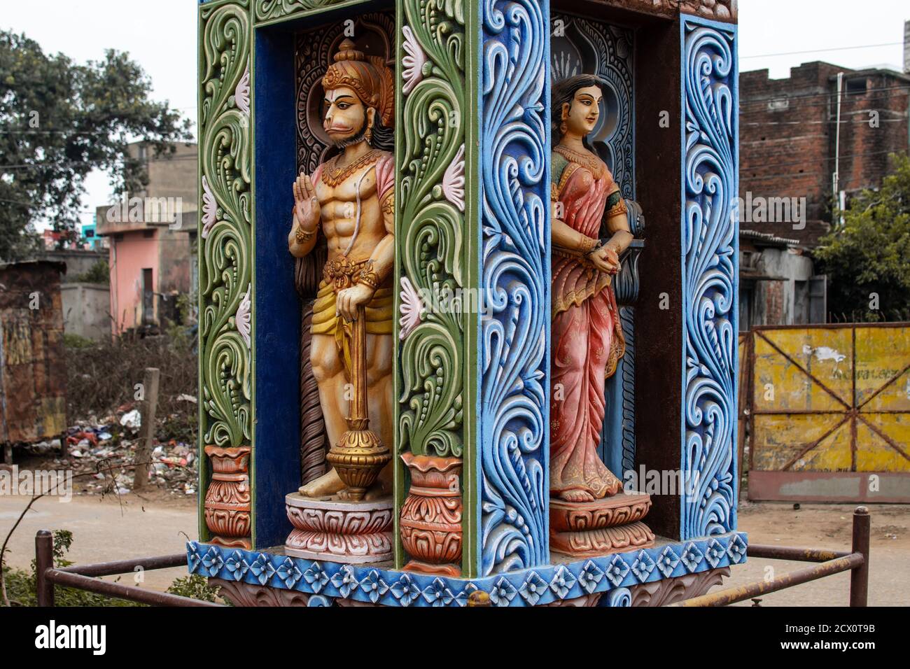 Two colorful hindu sculptures engraved in a big pillar in Puri, Odisha ...