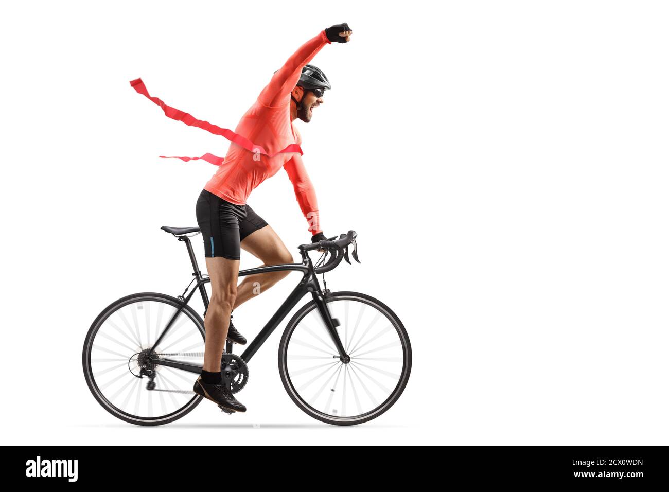 Male cyclist finishing a bicycle race at the finish line and gesturing ...
