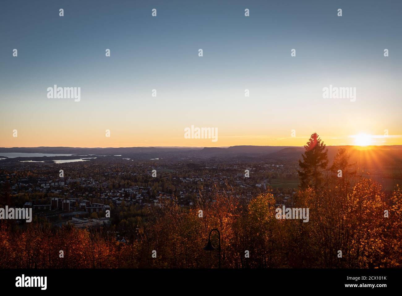 Oslo townscape with sun setting behind horizon. Panorama Stock Photo ...