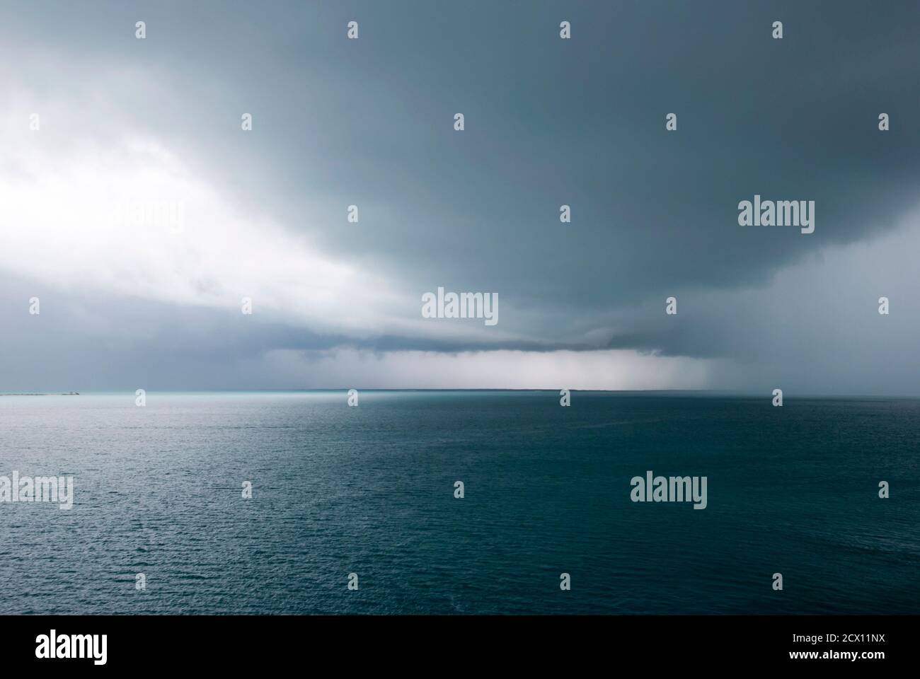 The rainy dark clouds covering Caribbean Sea outside Belize City ...