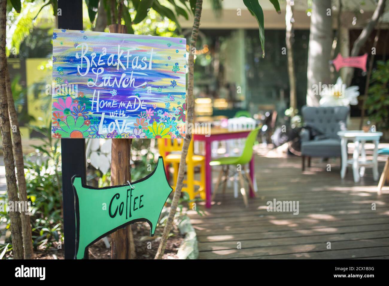 Photo of Colorful Entrance Sign of an Alice in Wonderland Themed ...