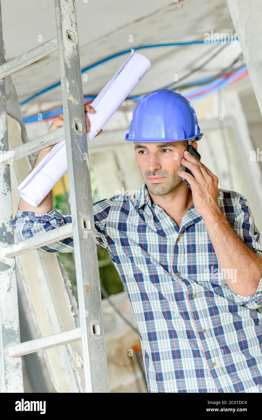Worker on a construction site Stock Photo - Alamy