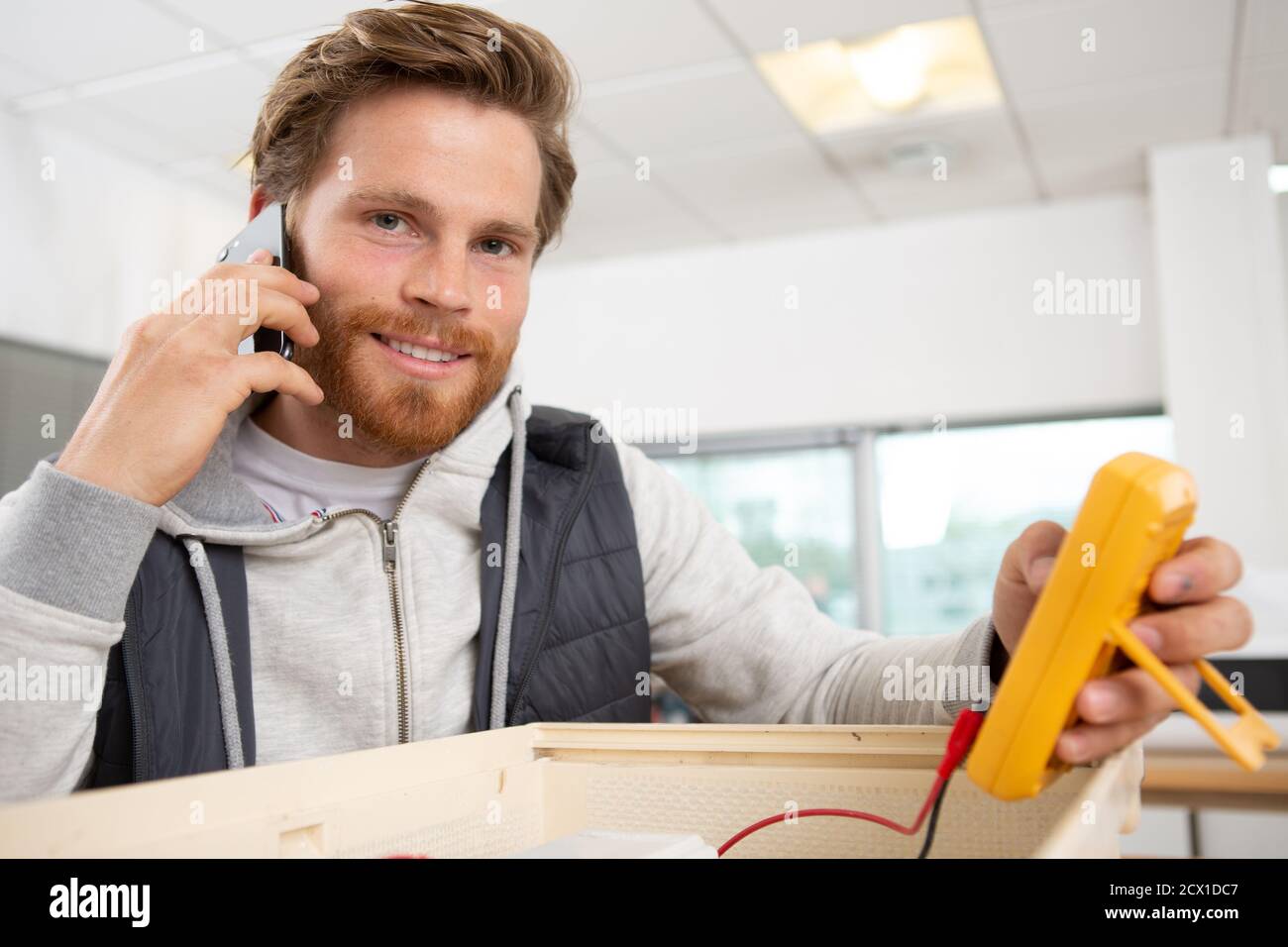 electric contractor is using the phone Stock Photo - Alamy